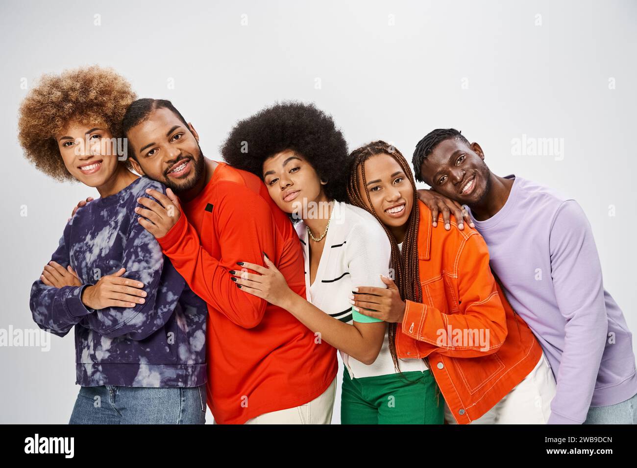happy african american community in casual attire leaning on each other ...