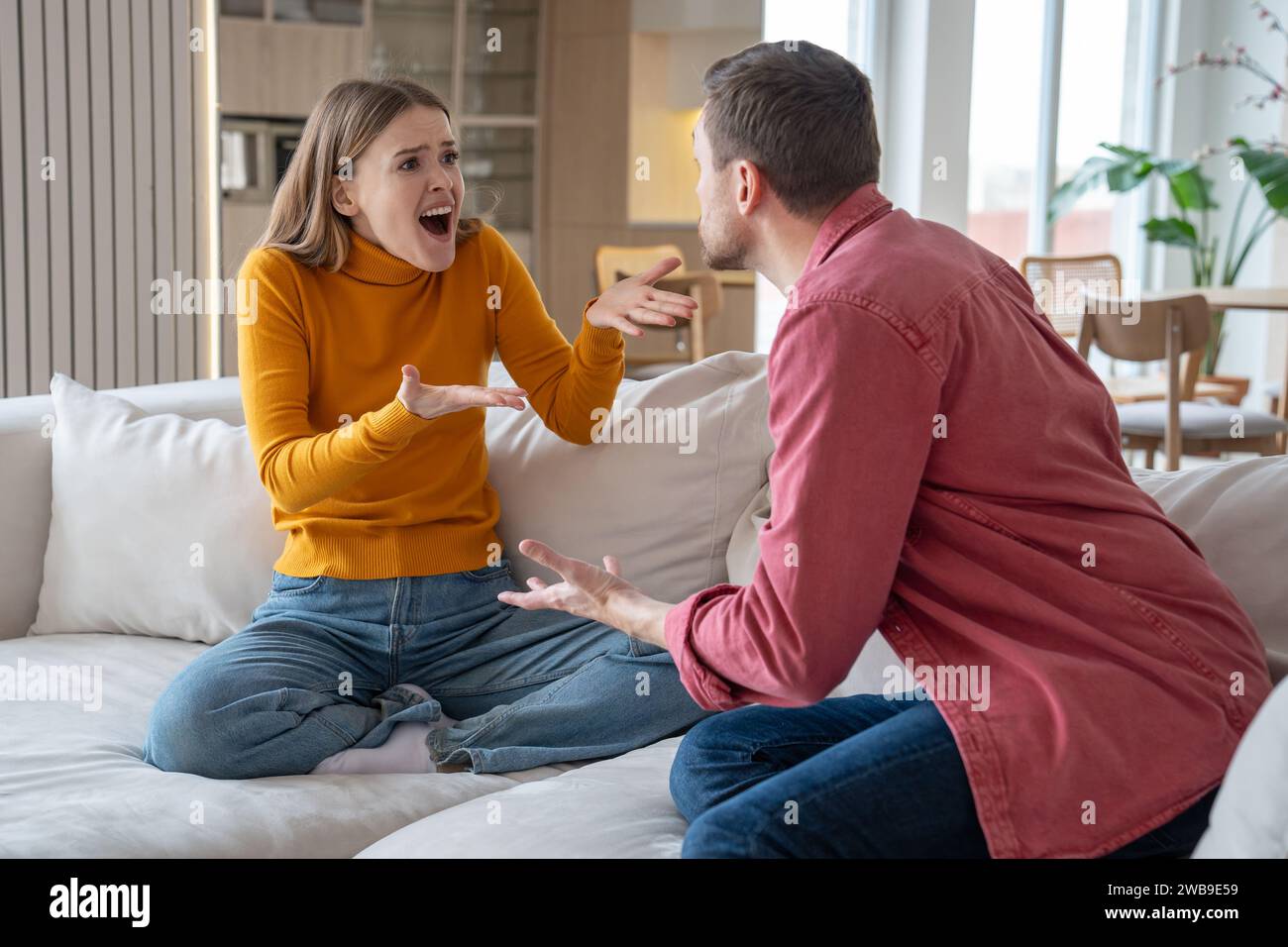 Reproachful wife shouting at delinquent husband. Misunderstanding and ...