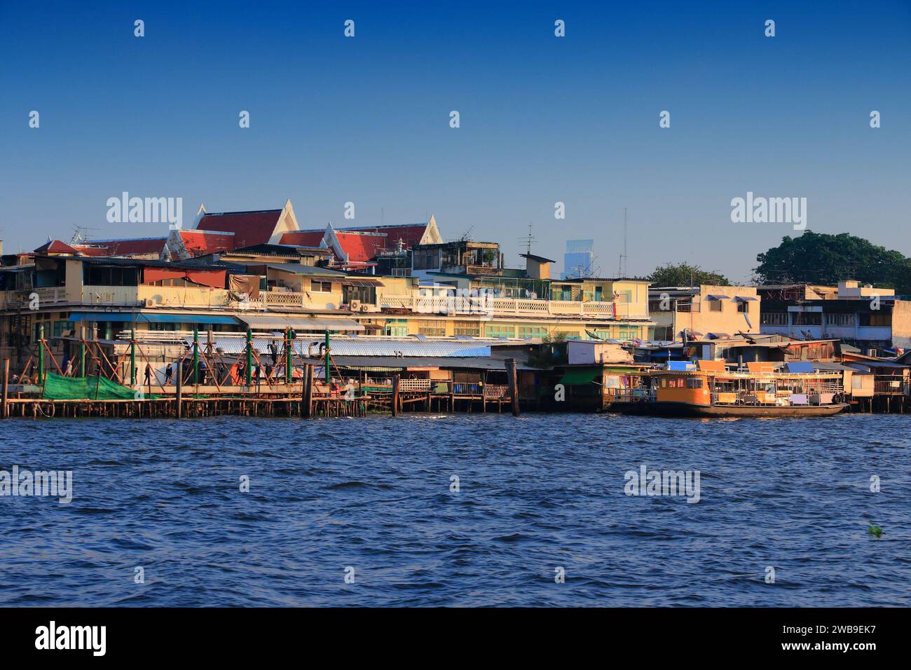 Bangkok city architecture. Chao Phraya river poor waterfront houses ...