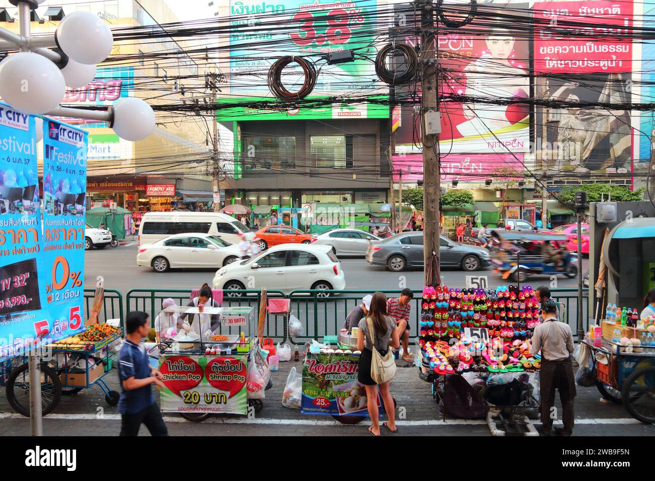 BANGKOK, THAILAND - DECEMBER 24, 2013: People drive in traffic jam in ...