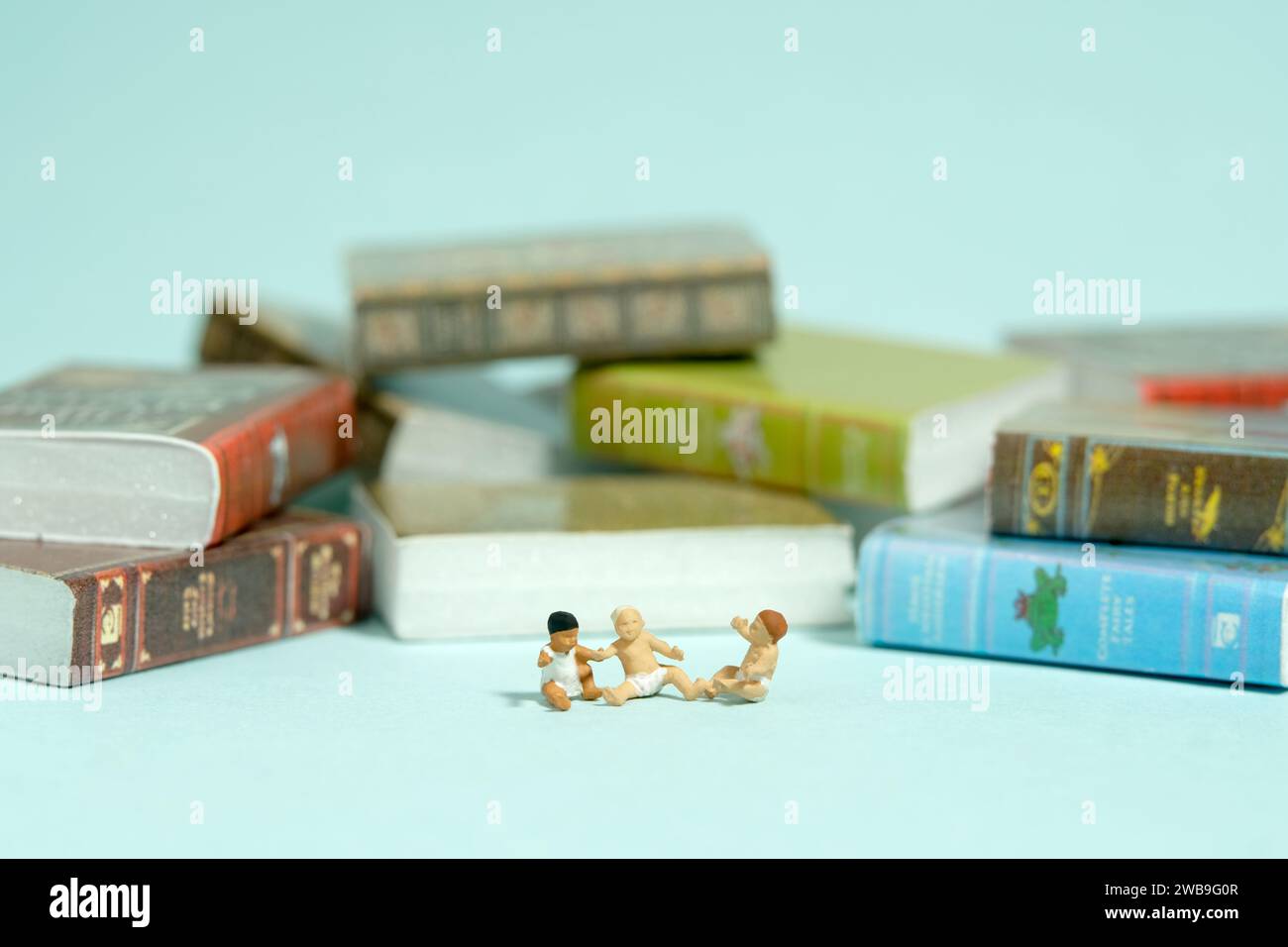 Miniature tiny people toy figure photography. Read concept. Group of ...