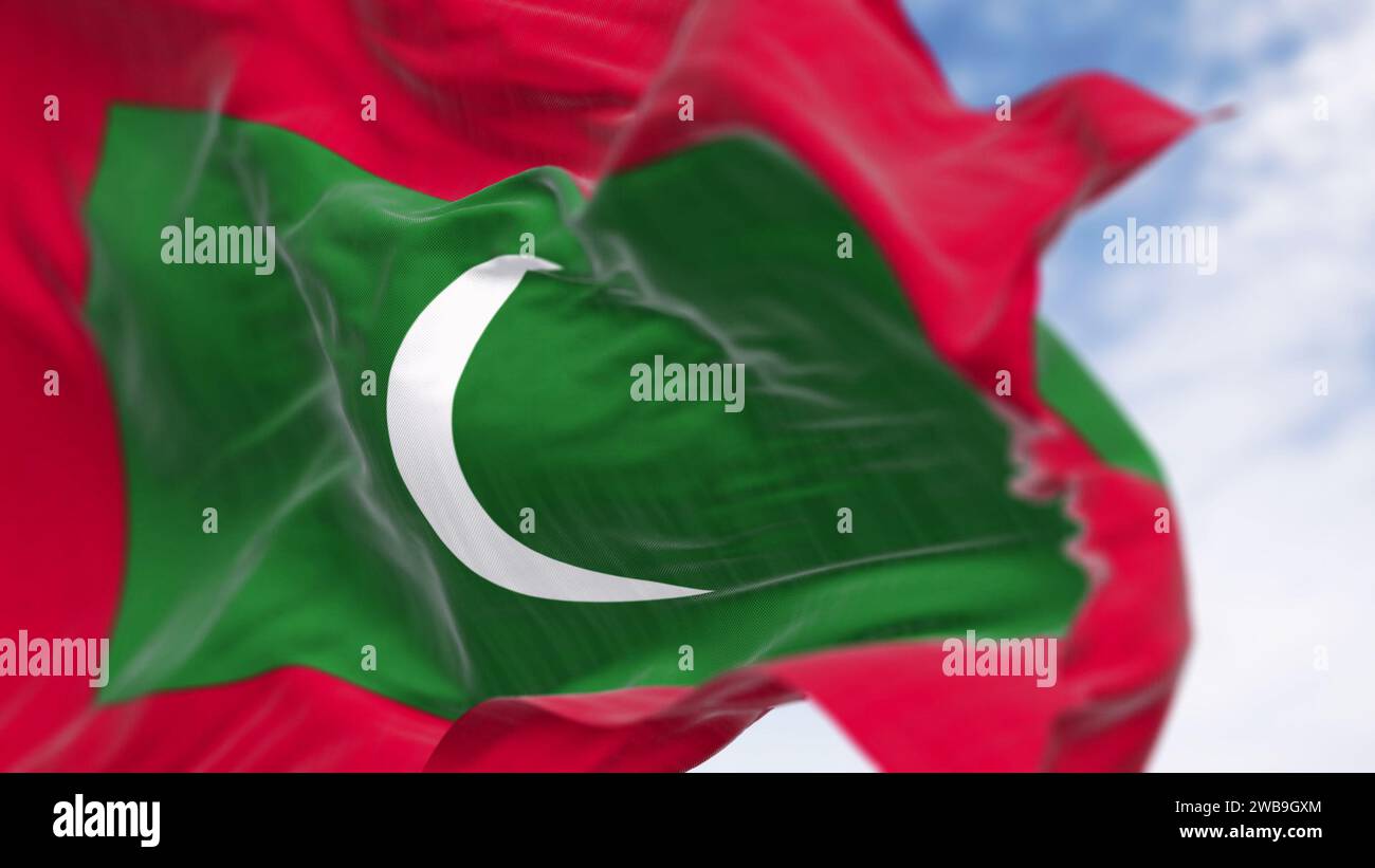 Close-up of Maldives national flag waving. Flag is a green rectangle on ...