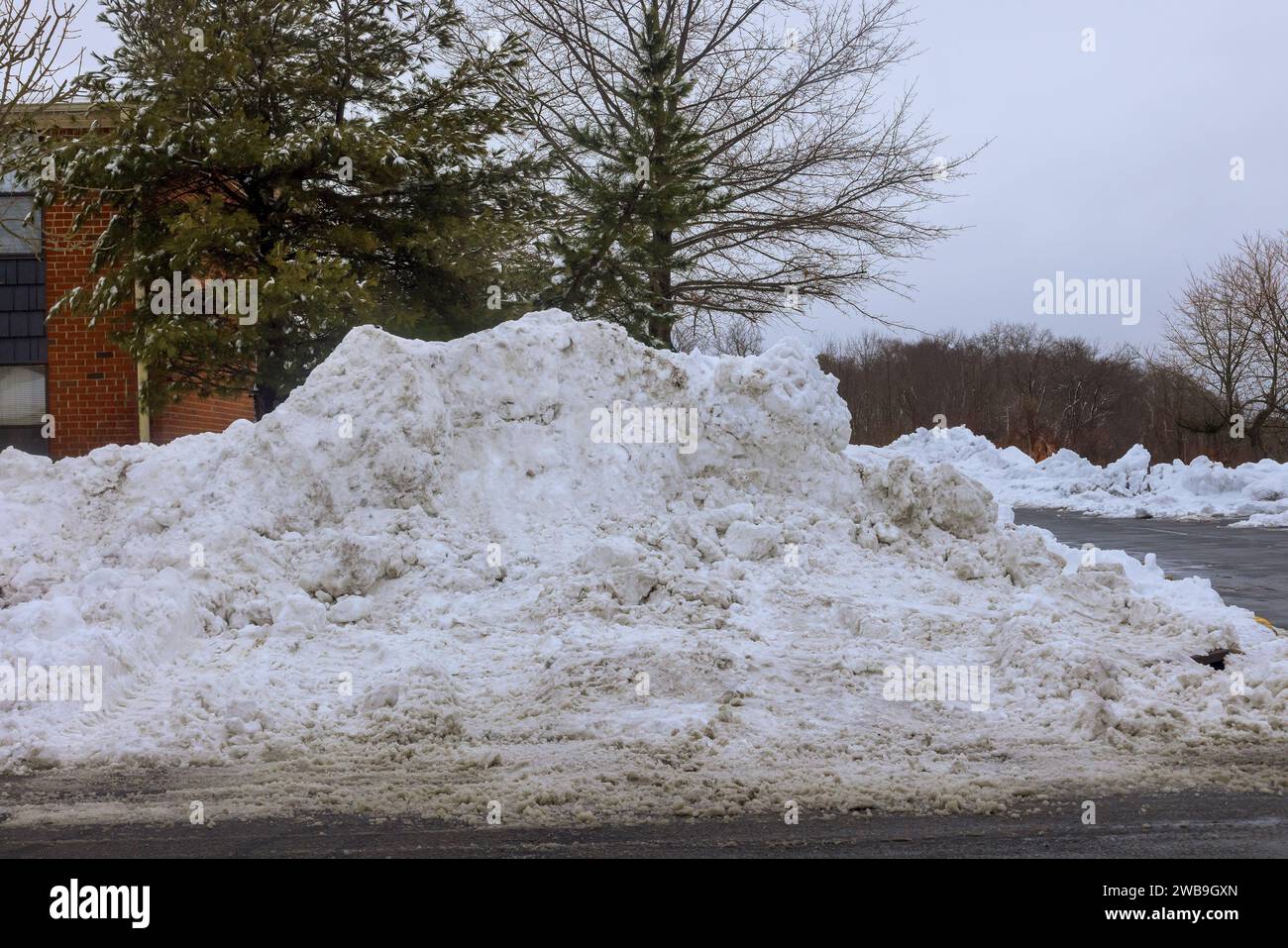 During winter months, parking lots near apartment buildings are covered ...