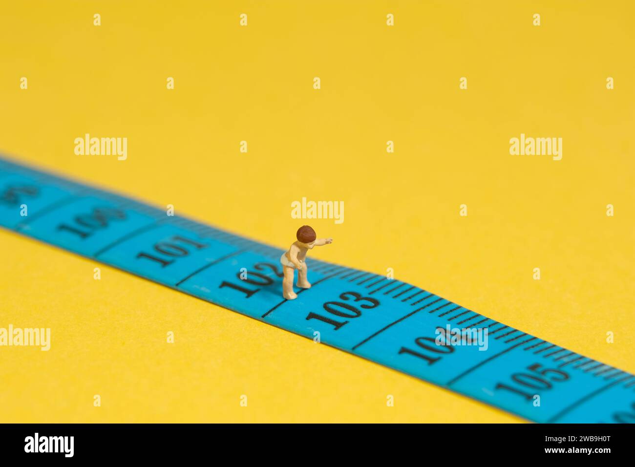 Miniature tiny people toy figure photography. Child growth period ...