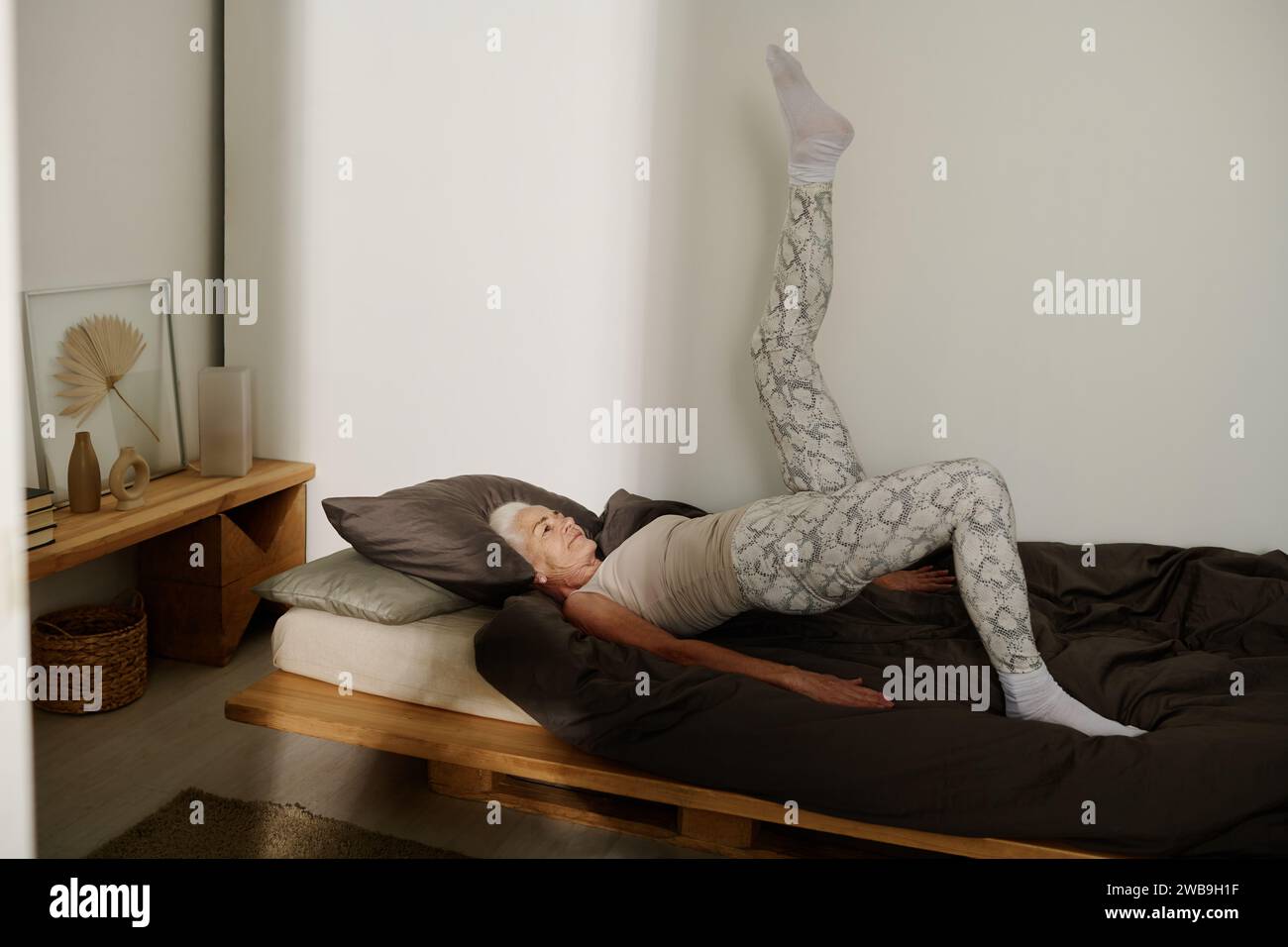 Woman leg raise bed hi-res stock photography and images - Alamy