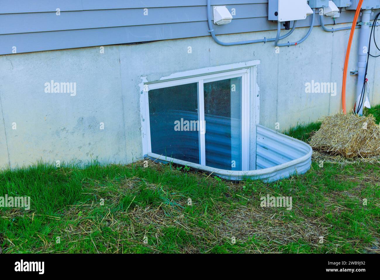 Installing window well in basement of newly constructed house Stock ...