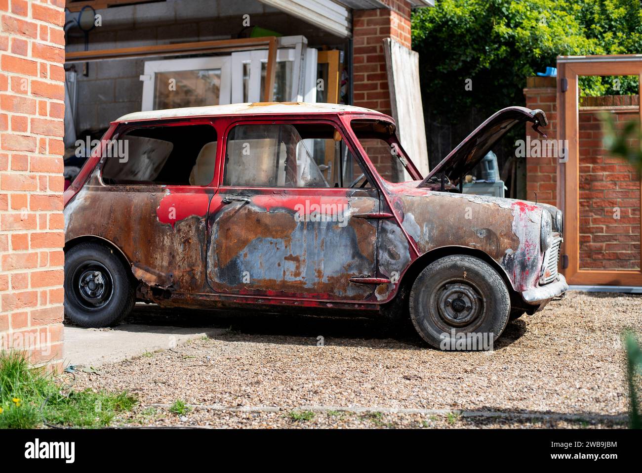 Fire damaged classic Mini car Stock Photo - Alamy