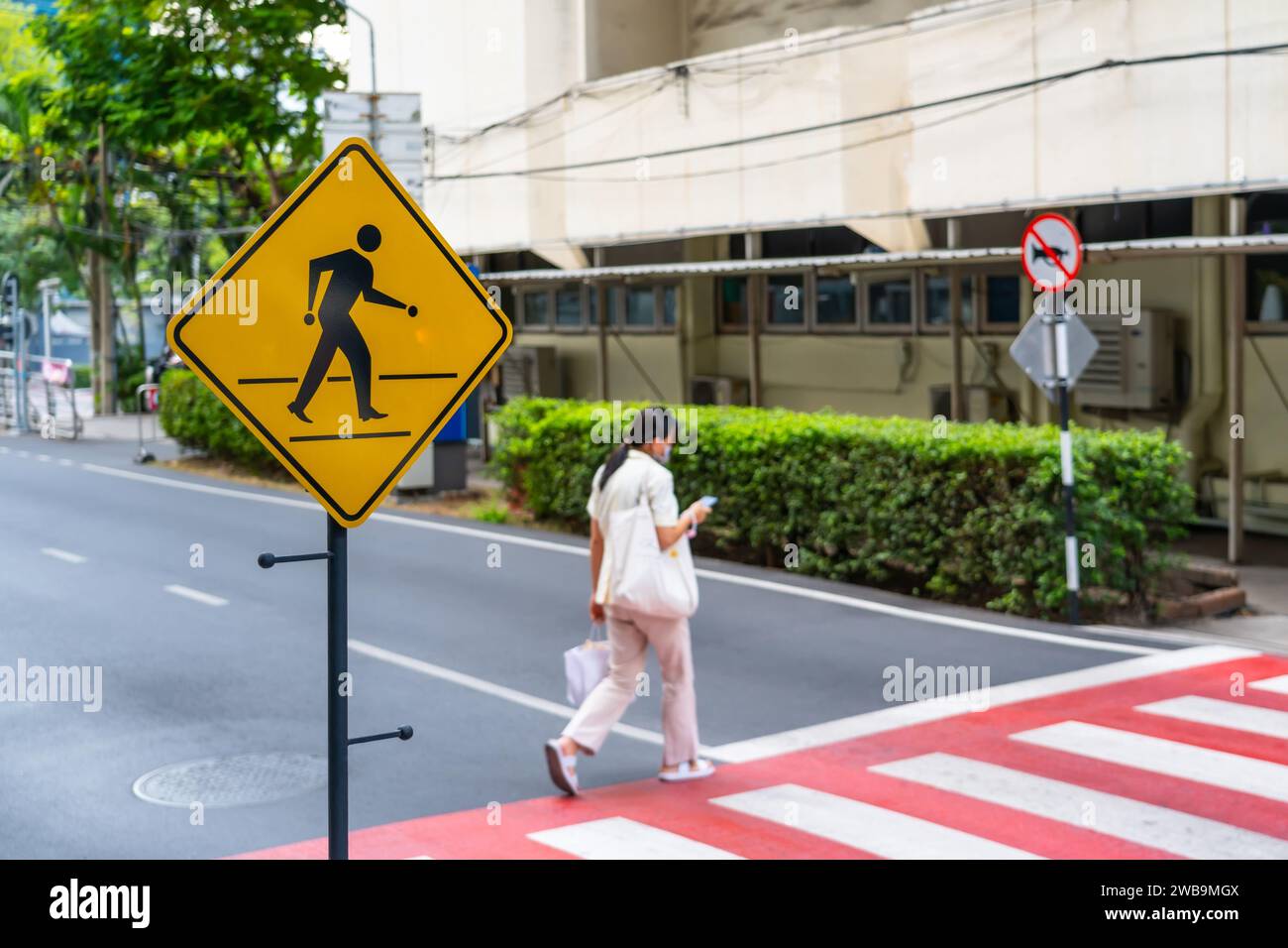 Woman crosses a pedestrian crossing hi-res stock photography and images ...