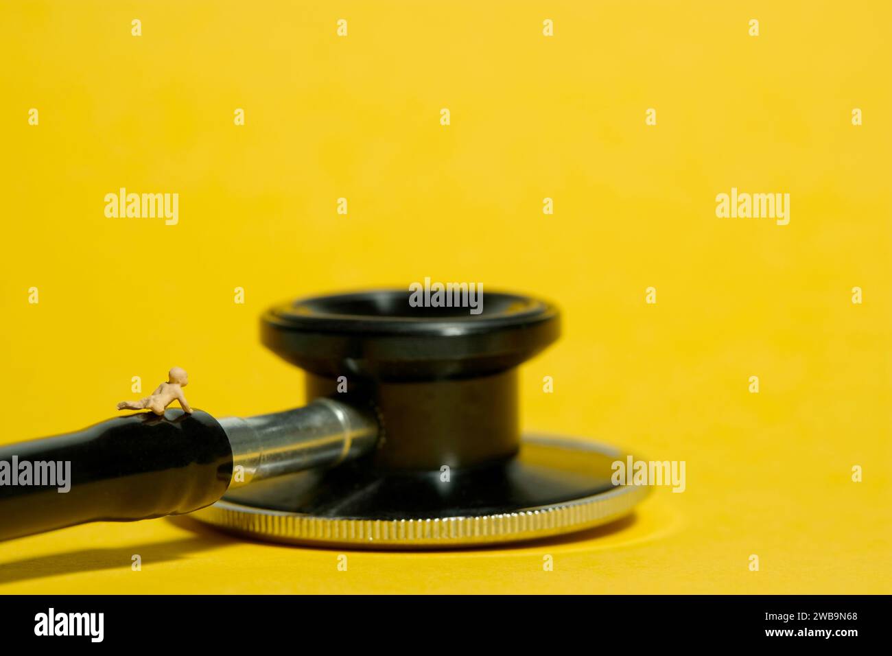 Miniature tiny people toy figure photography. A baby crawling above ...