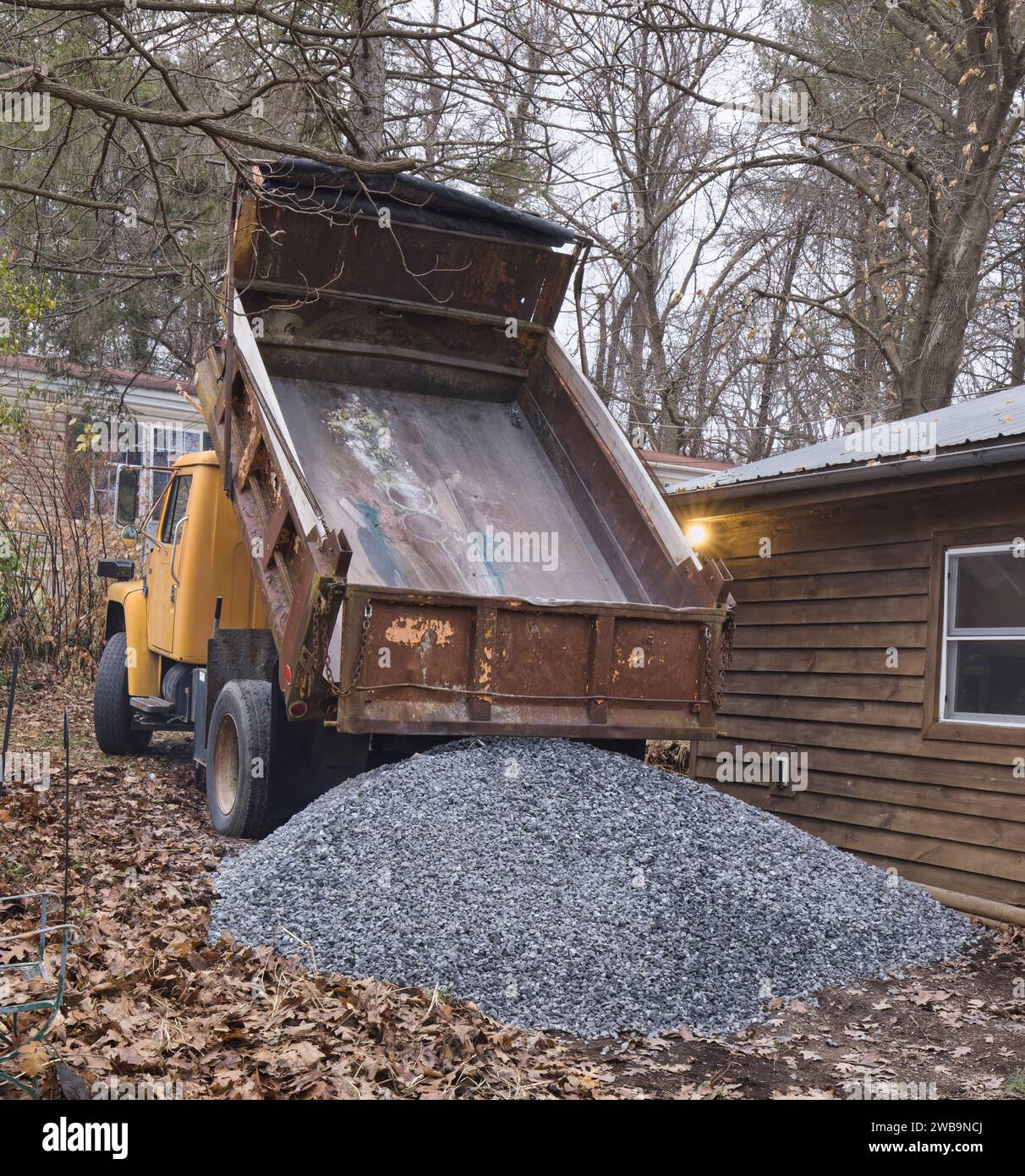 Dump truck dumping gravel Stock Photo - Alamy