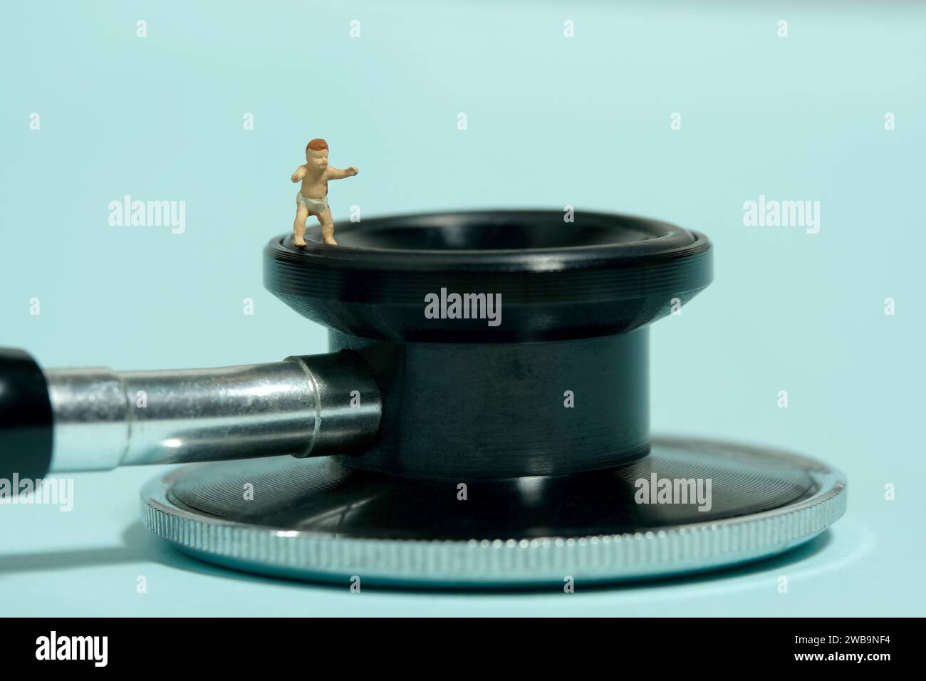 Miniature tiny people toy figure photography. A boy baby toddler ...