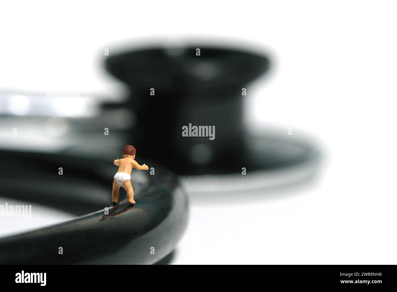 Miniature tiny people toy figure photography. A boy baby toddler ...