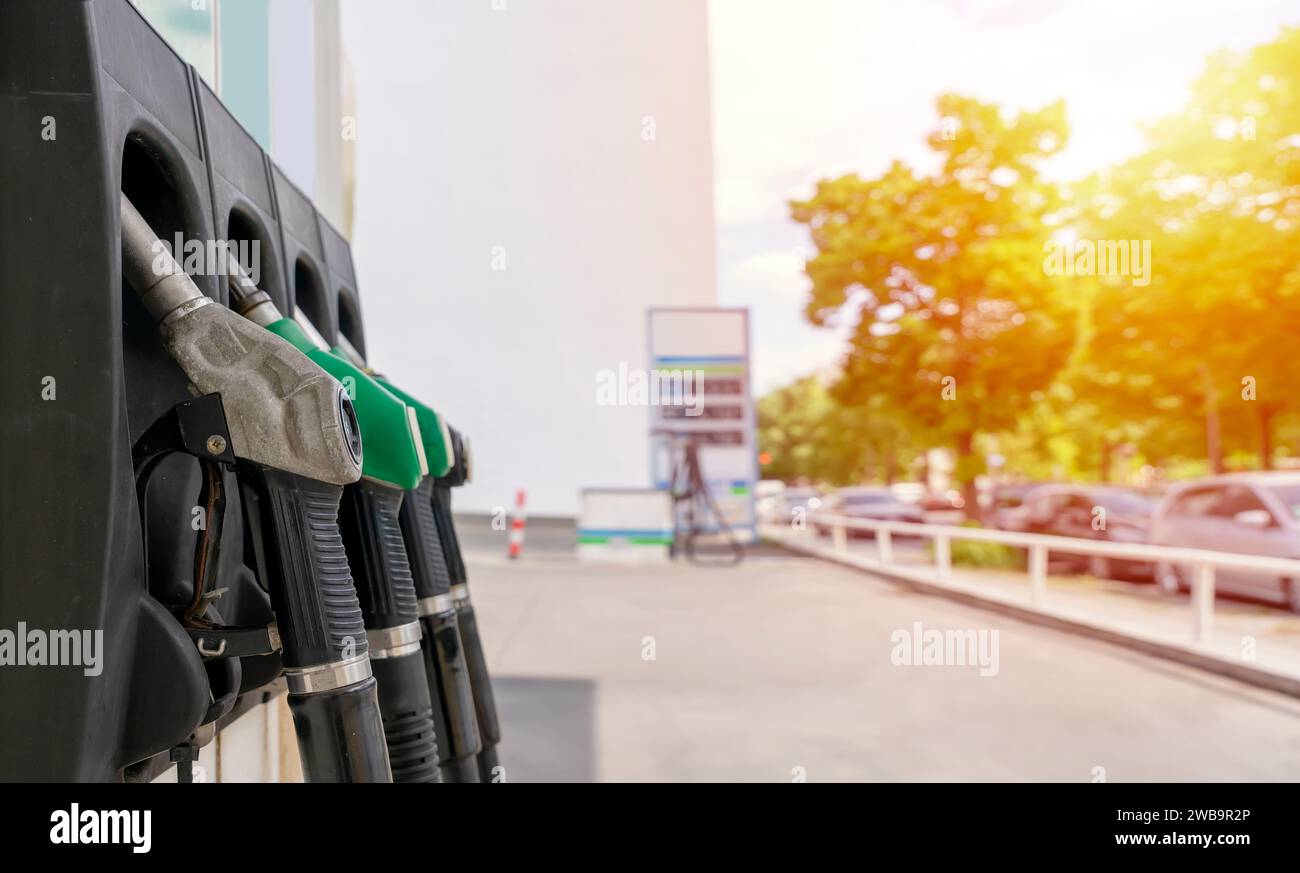 Close up of diesel and petrol fuel pistols at a gas station. The fuel ...