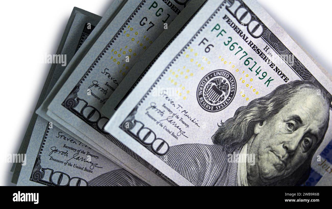 Close up view of one hundred dollar bills isolated on white background ...