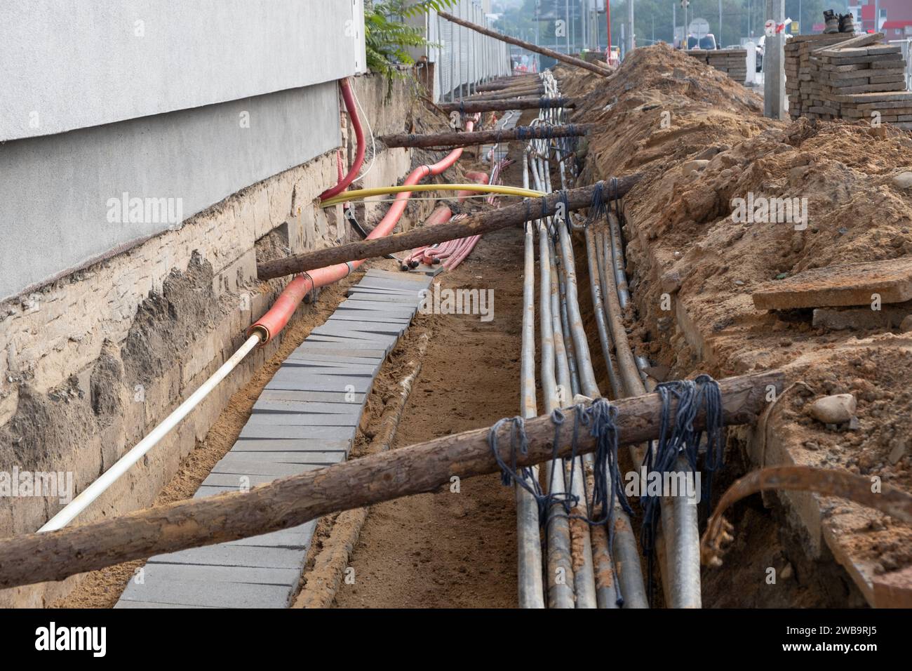 Construction work. Line of old and new cables buried underground on the ...