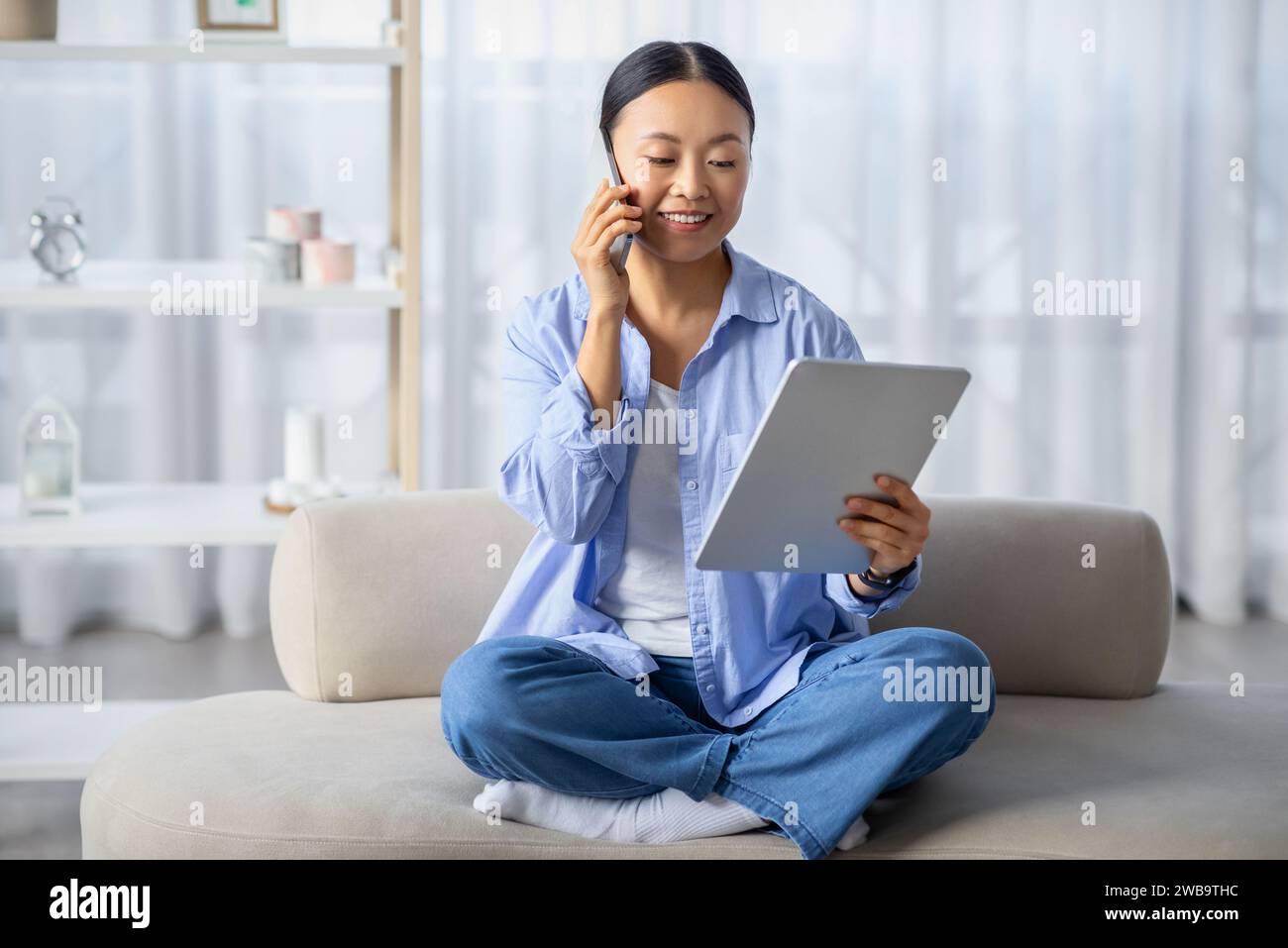 Chinese businesswoman working from home, have phone conversation Stock ...