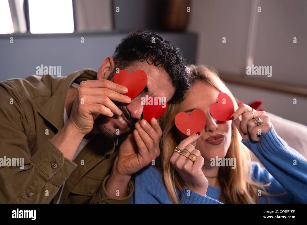 Valentine's Day. Close-up photo of happy couple in love hiding eyes ...