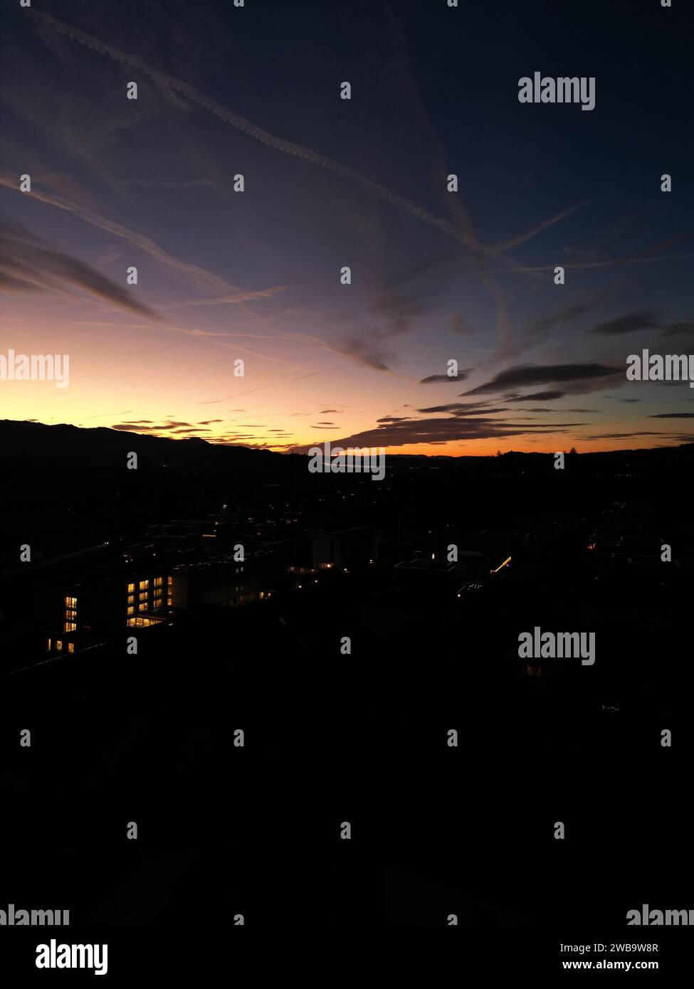 A spectacular view of the night sky from the roof of a city building ...