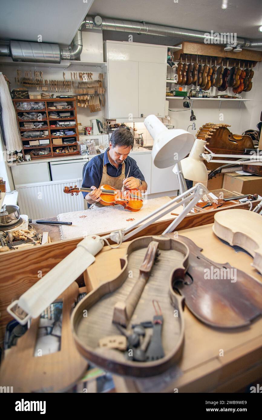 violin maker in his workshop. photo: Bo Arrhed Stock Photo - Alamy