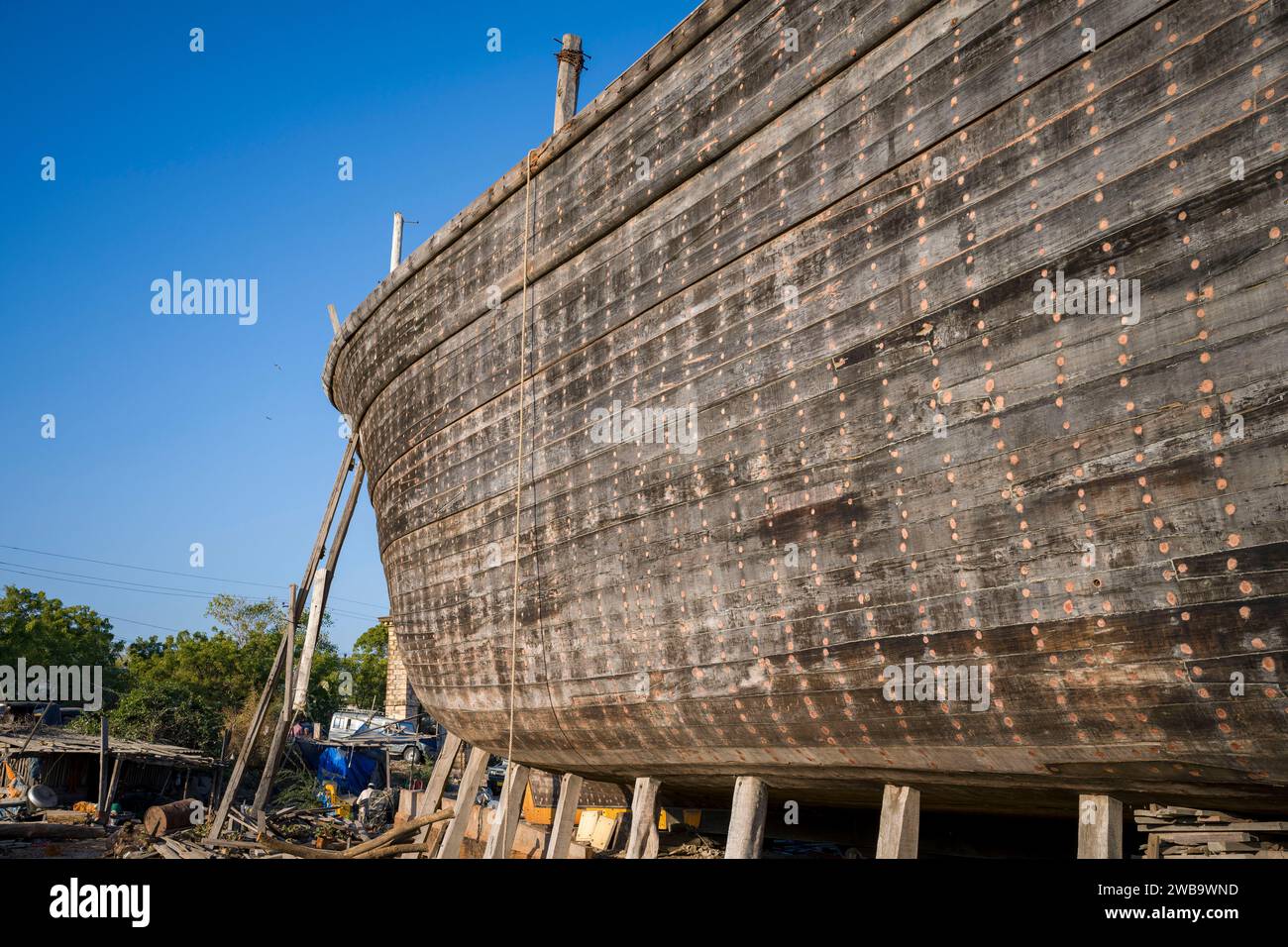 Sealant markings are visible on the side of a traditional ship under ...