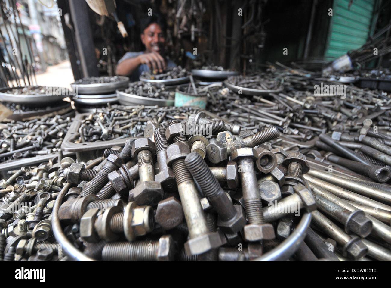 Sellers sell old car parts at the old car parts market in Dholaikhal ...