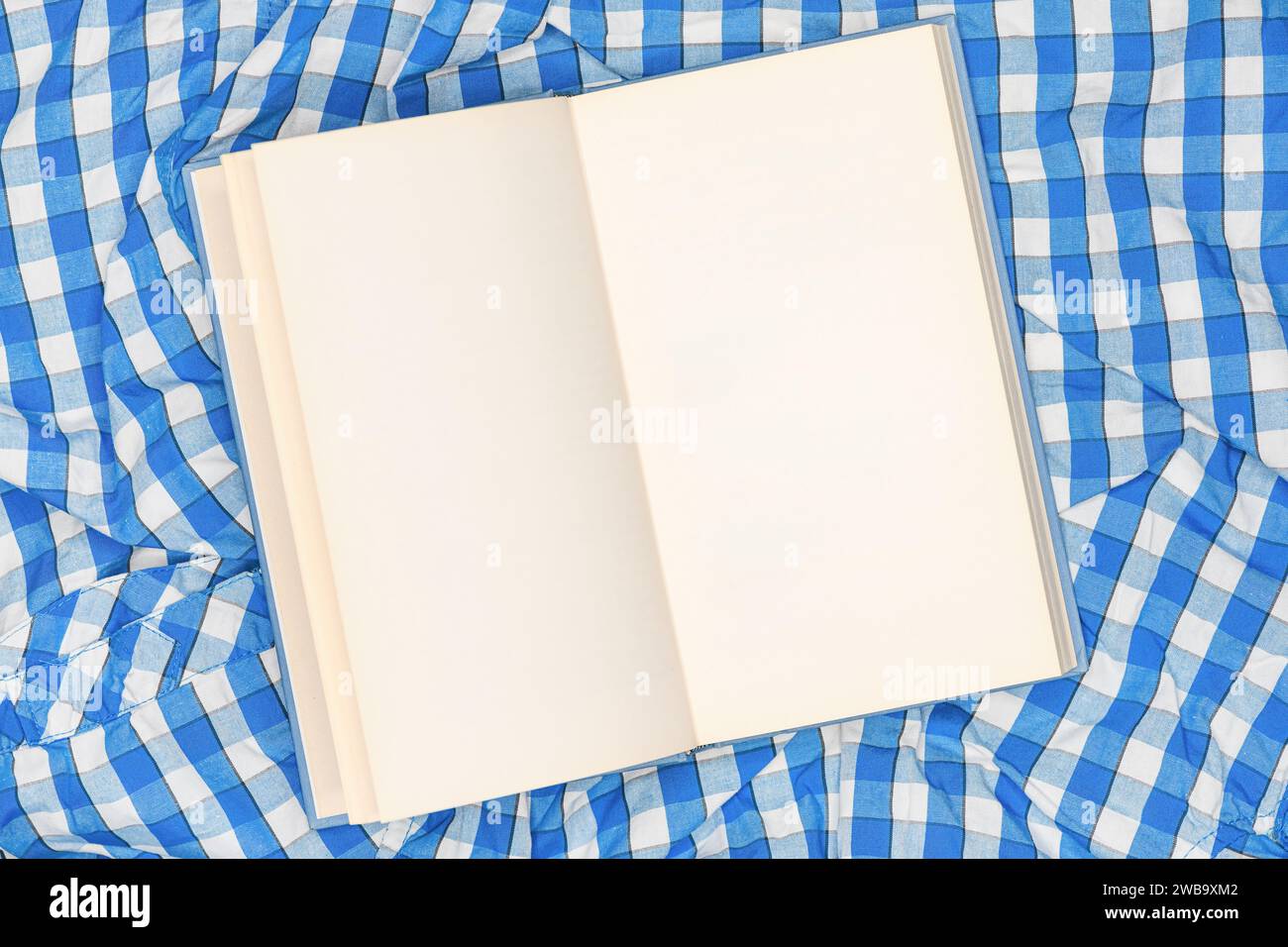 Open book pages mockup on plaid cloth, top view Stock Photo - Alamy