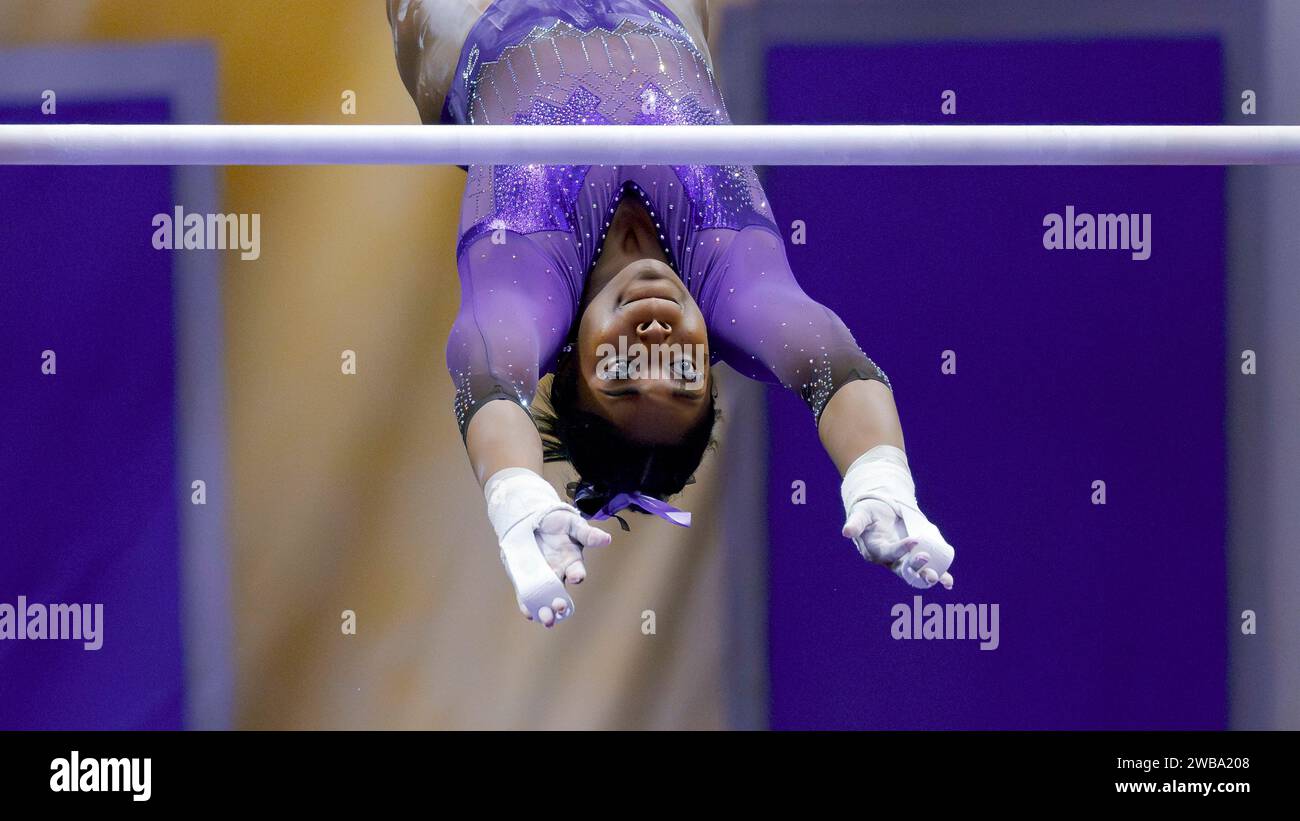 LSU graduate student Kiya Johnson performs an uneven bars routine ...