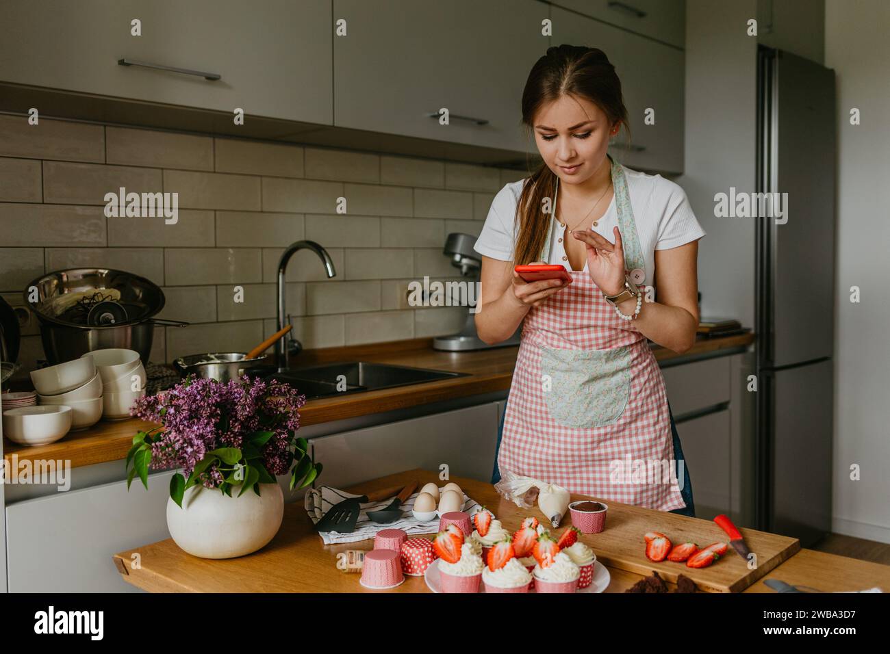 food, culinary, technology and people concept - woman hands with ...