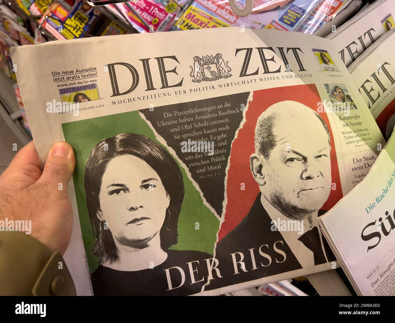 Frankfurt, Germany - Feb 9, 2023: A male hand holds the latest issue of ...