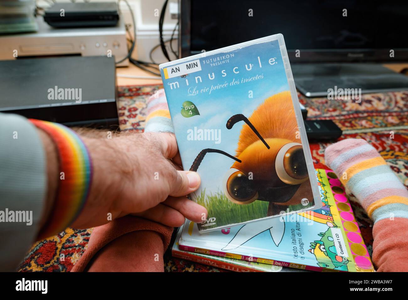 Paris, France - Dec 16, 2023: A hand holds the DVD Dobo l'Inventeur ...