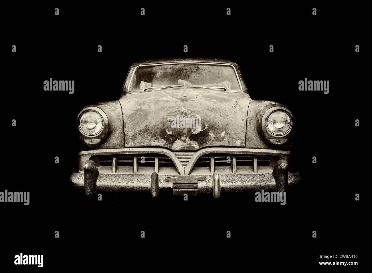 Black and white front view of a heavily weathered fifties car Stock ...
