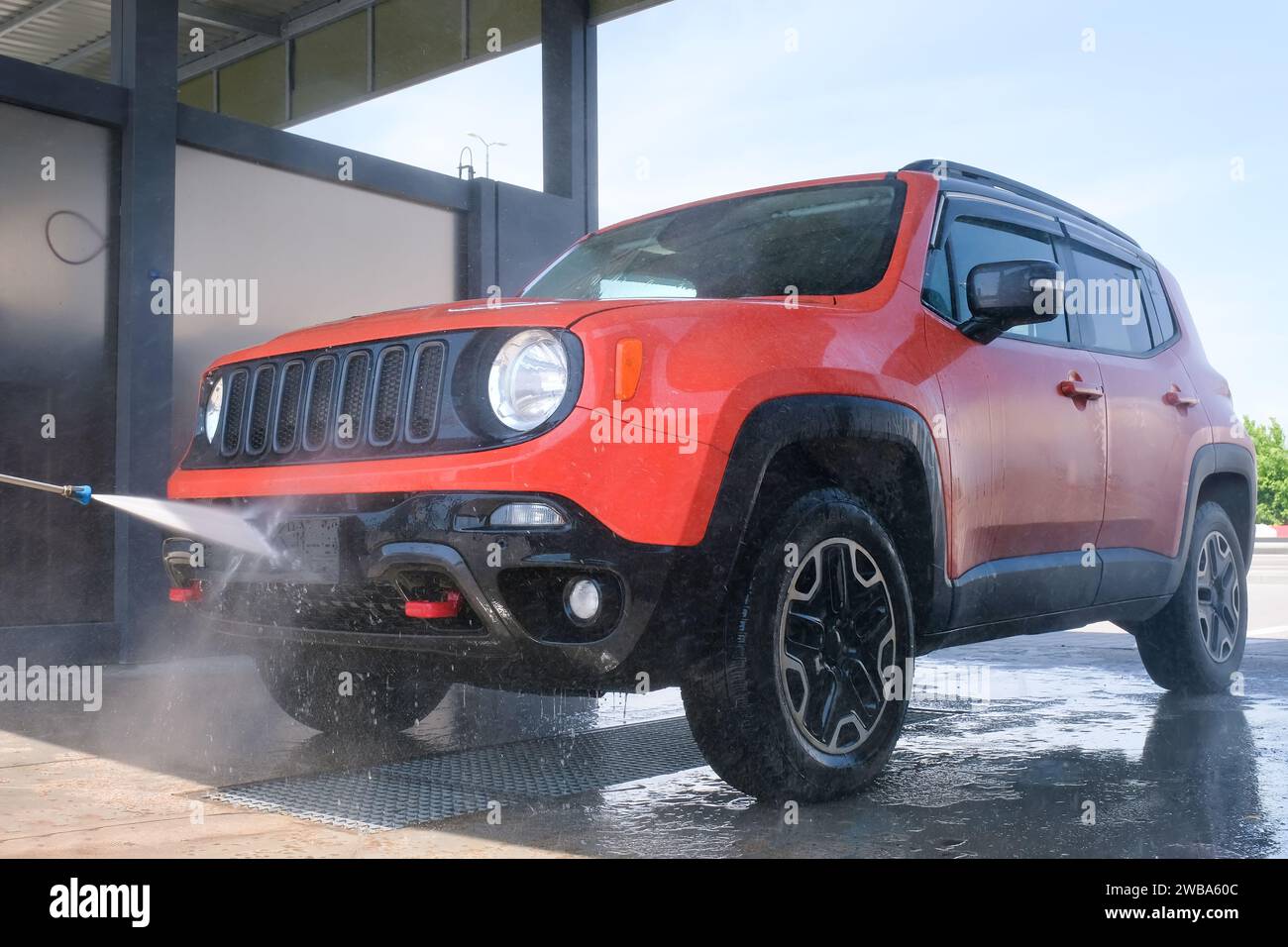 Car wash under high pressure water at a car wash Stock Photo - Alamy
