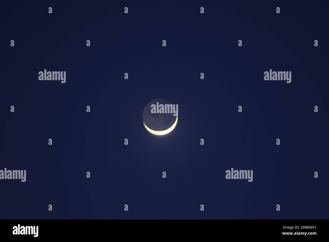 A beautiful night sky showcasing a full moon and its crescent shape ...