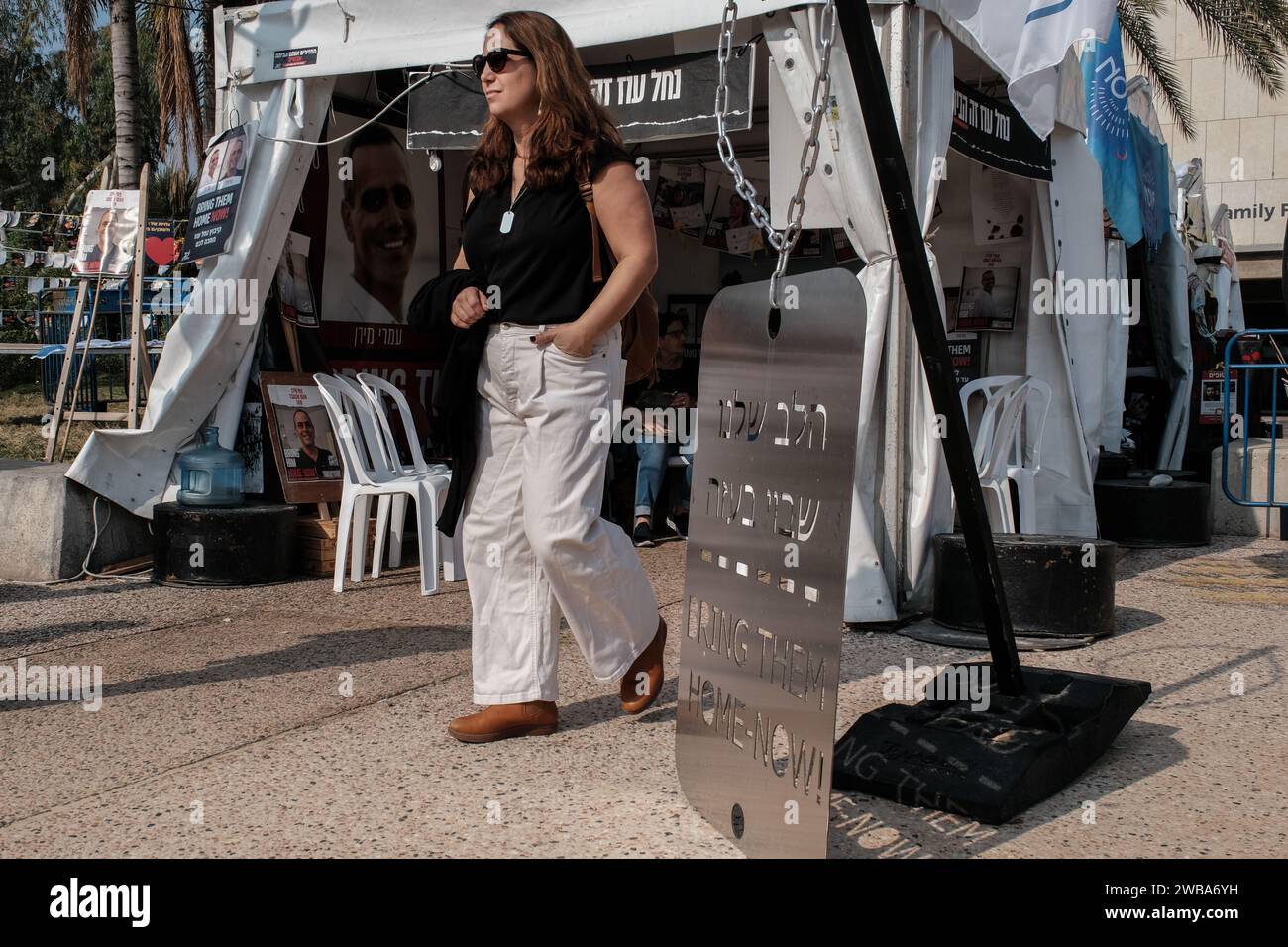 Tel Aviv, Israel. 9th Jan, 2024. A woman wears a Bring Them Home Now ...