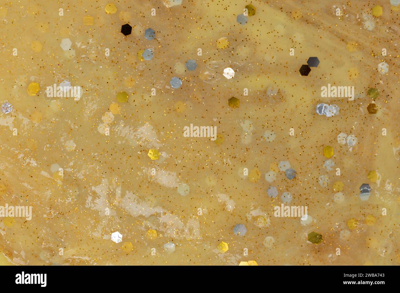 Glitter yellow slime surface macro close up view Stock Photo - Alamy