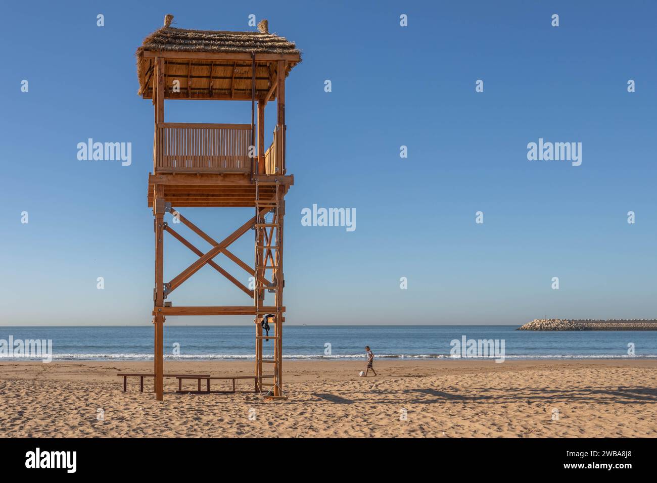 Wooden lifeguard tower on Agadir beach on a warm, sunny day with deep ...