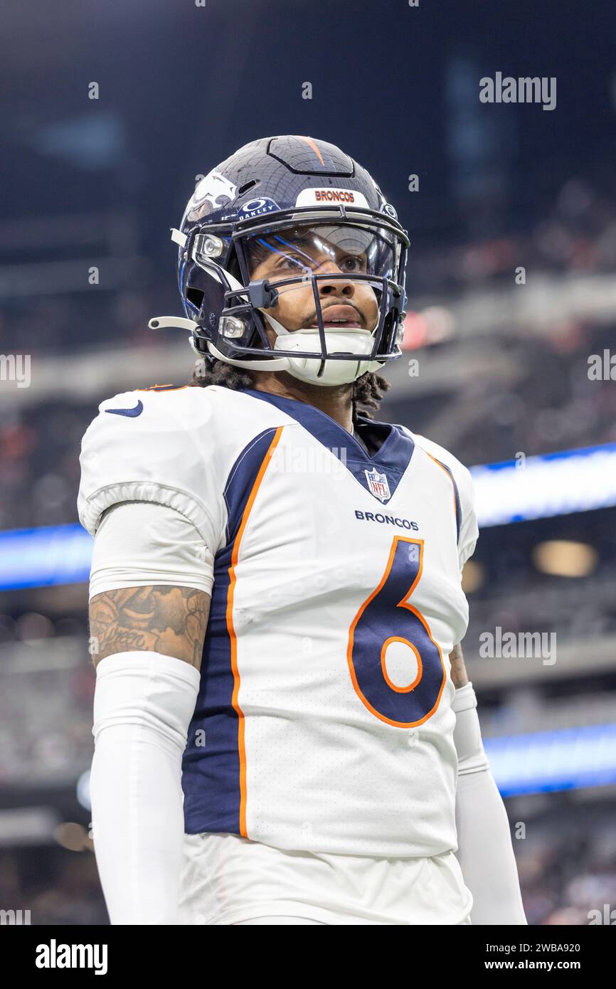 Denver Broncos safety P.J. Locke (6) warms up before playing against ...