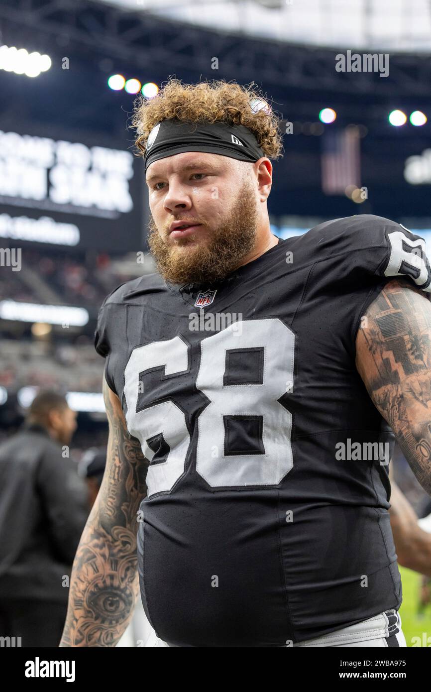Las Vegas Raiders center Andre James (68) exits the field after warming ...