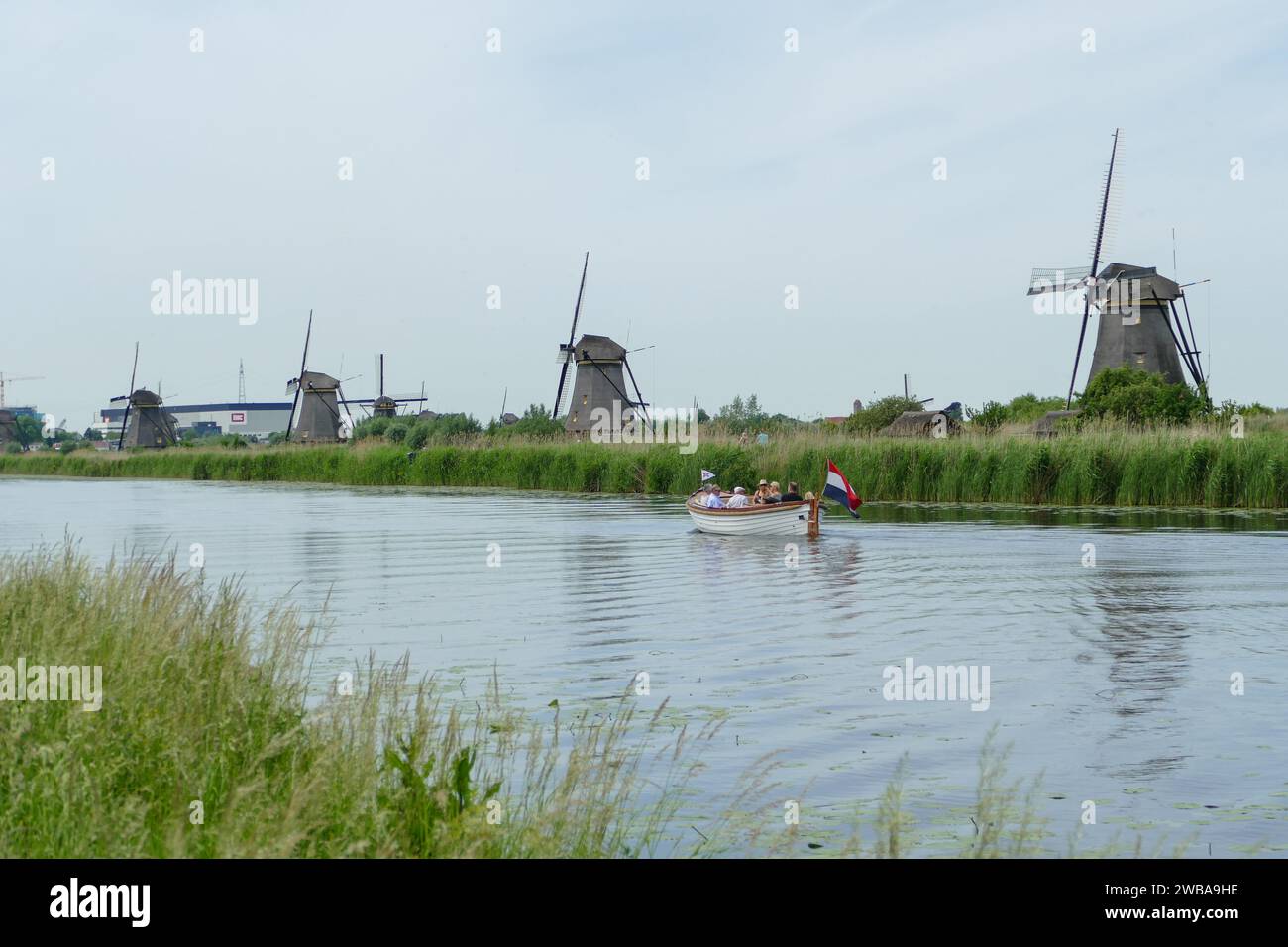 Kinderdijk, Netherlands - May 28 2017: Kinderdijk canal with historic ...