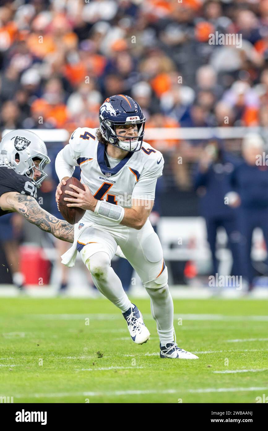 Denver Broncos quarterback Jarrett Stidham (4) scrambles against the Las Vegas Raiders in an NFL ...
