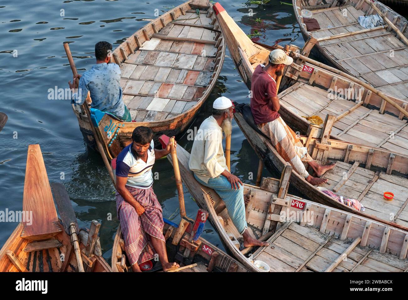 Open wooden ferry boats on the Buriganga River in Dhaka Bangladesh Stock Photo - Alamy