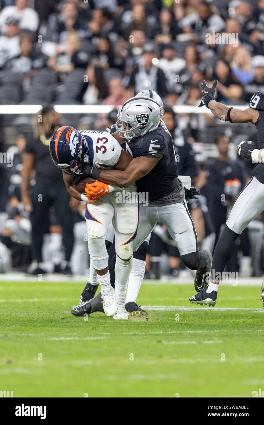 Las Vegas Raiders linebacker Divine Deablo (5) tackles Denver Broncos ...
