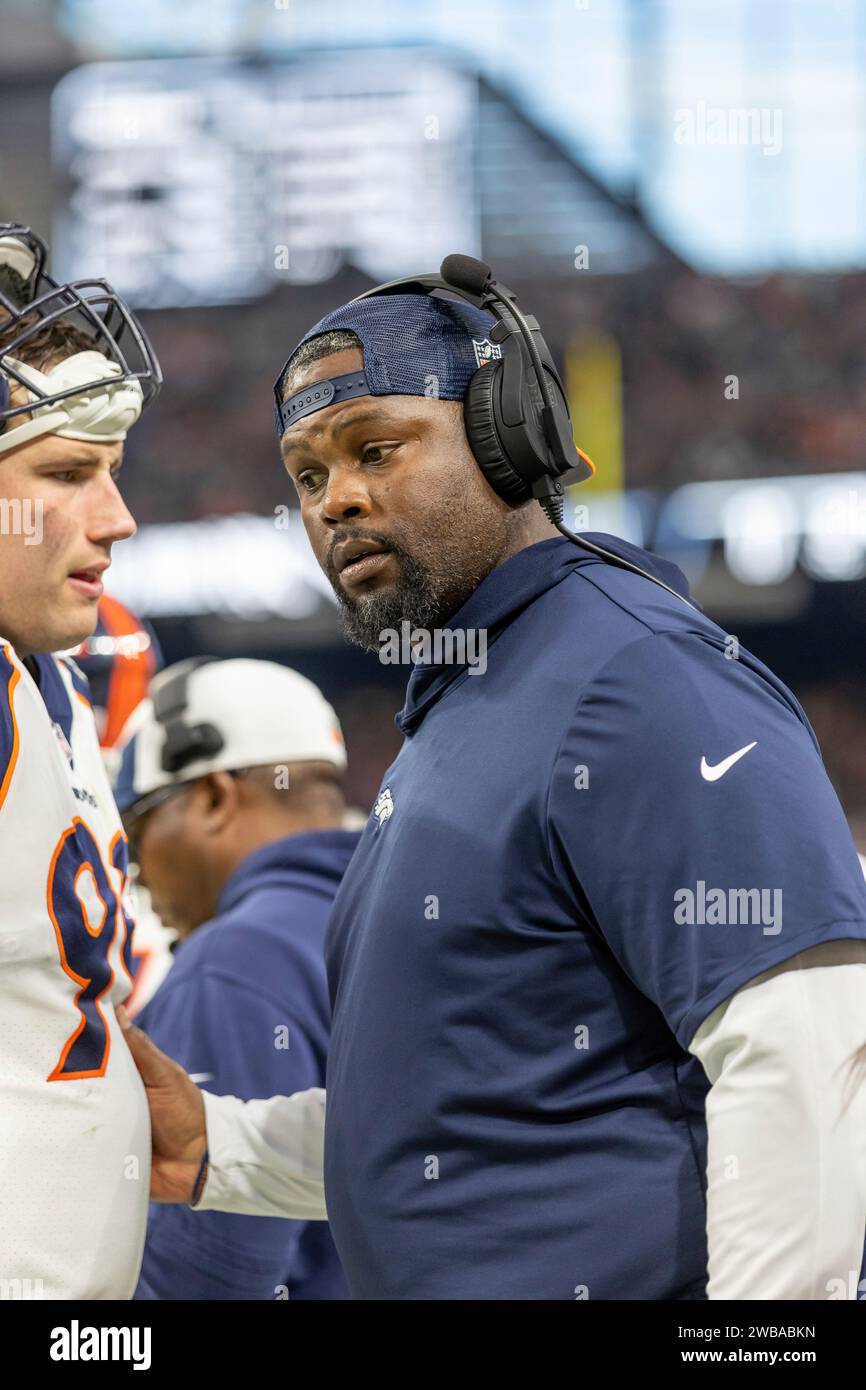 Denver Broncos defensive line coach Marcus Dixon coaches against the ...
