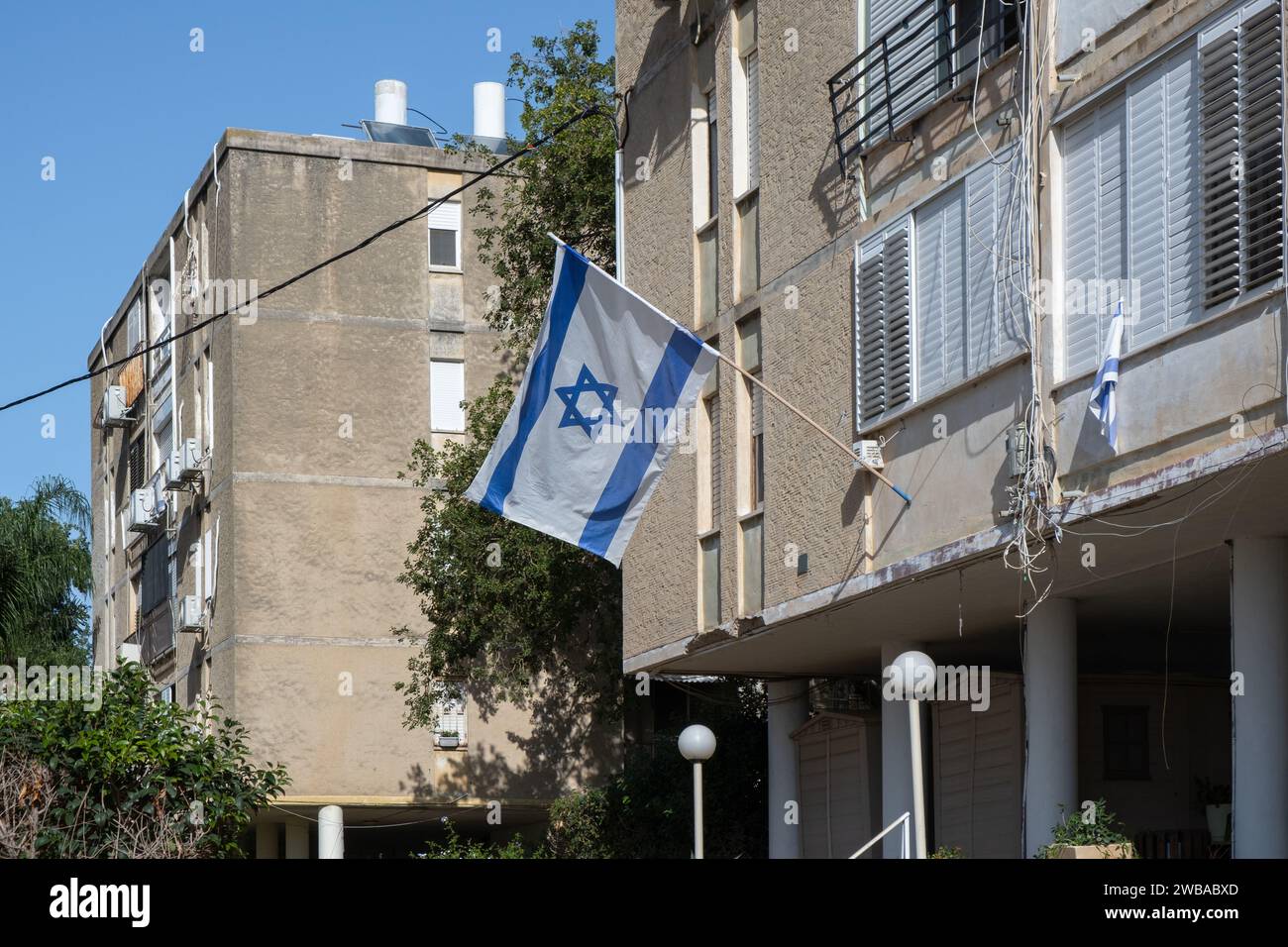 National Israeli flag waving in the background of a typical apartment ...
