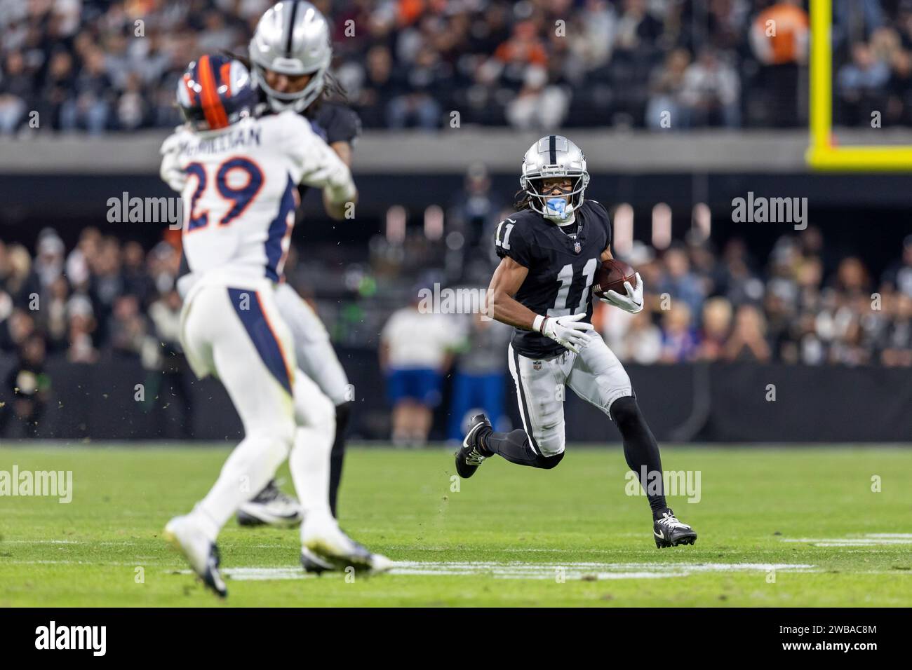 Las Vegas Raiders wide receiver Tre Tucker (11) catches a pass and runs ...