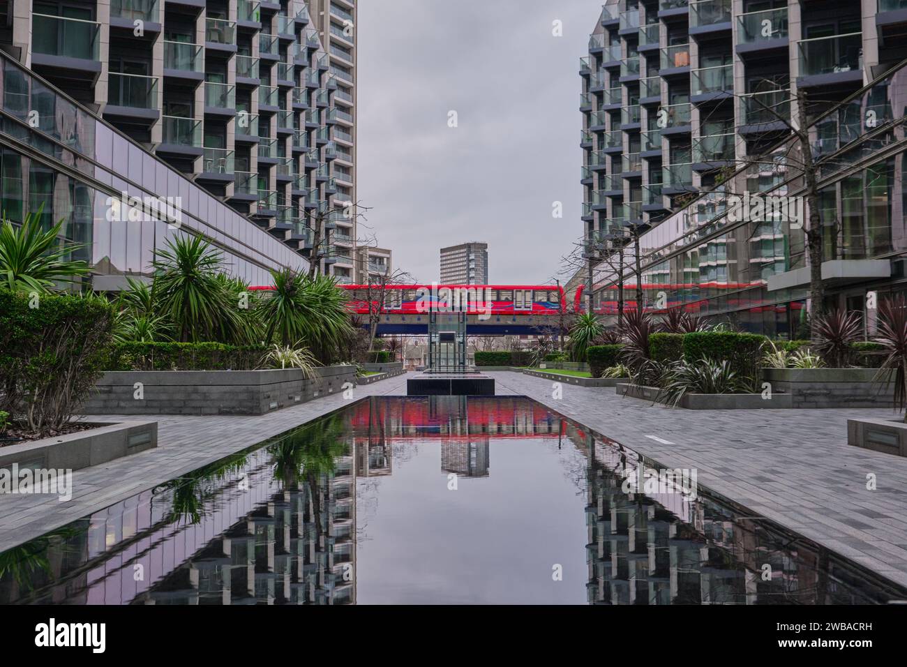 Baltimore Wharf residential tower blocks and ponds, with a passing DLR ...