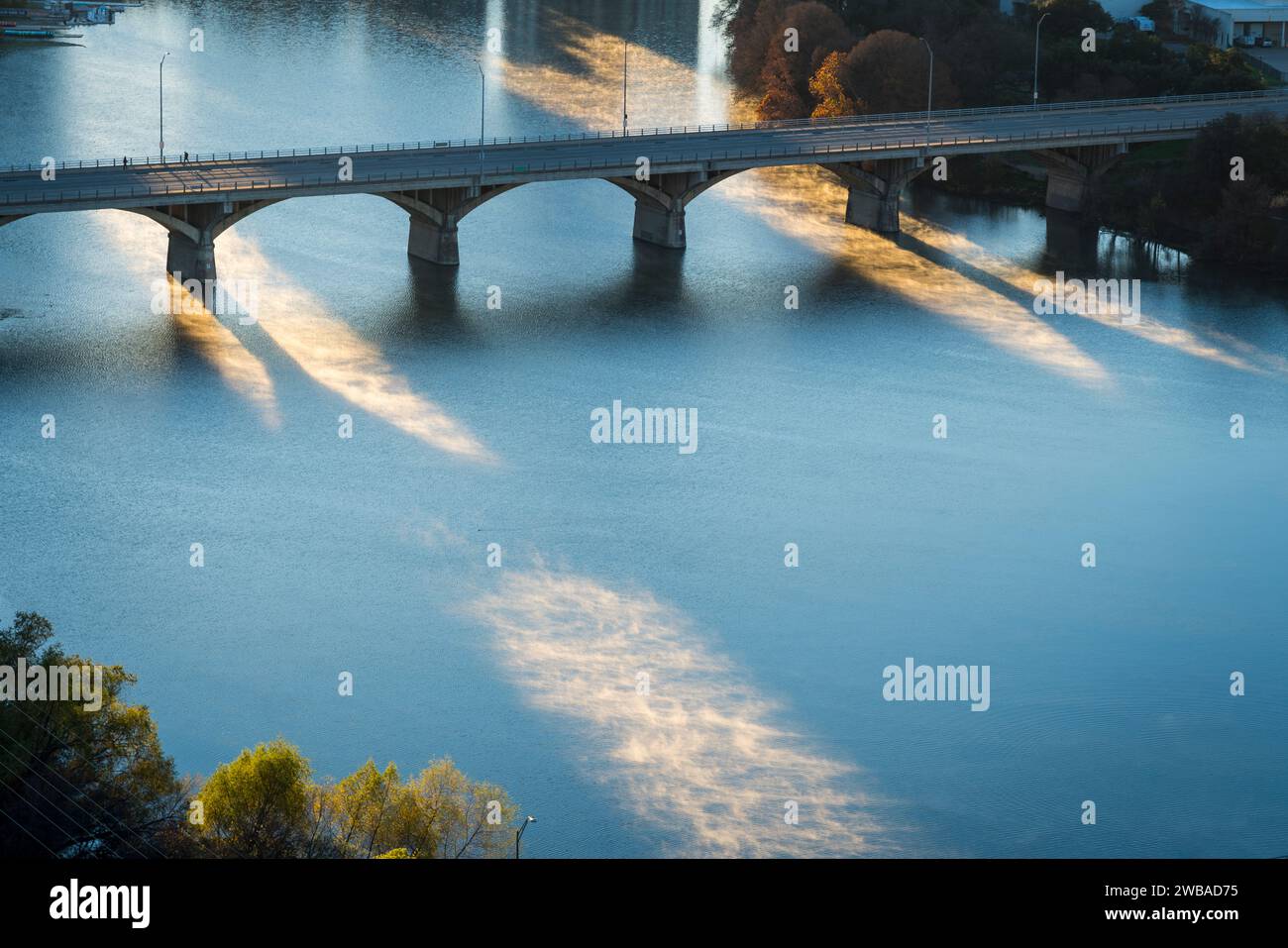 Mist rising on Ladybird Lake with Congress Street Bridge in Austin ...