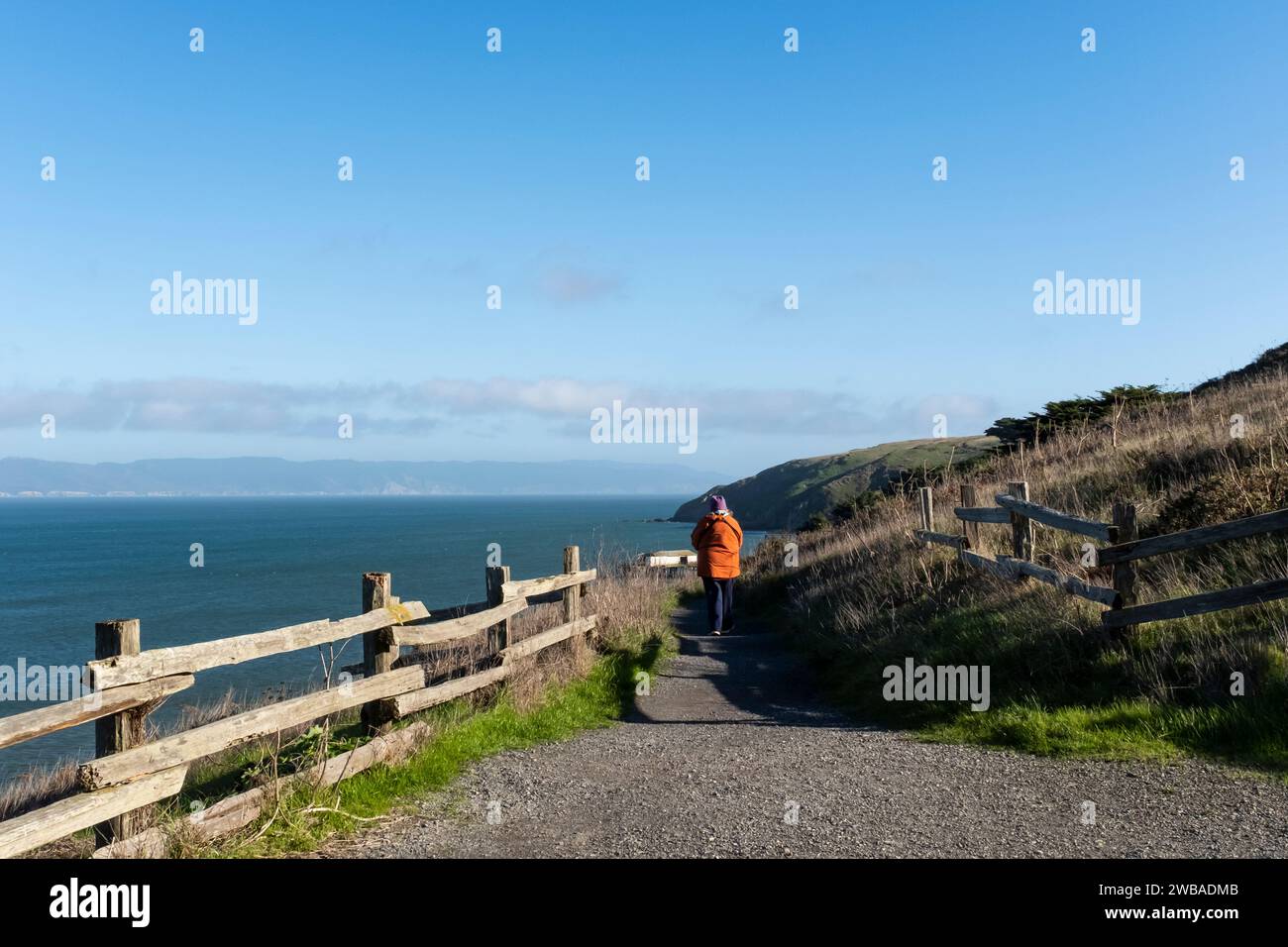 An active senior woman hikes along the California coast at Point Reyes ...
