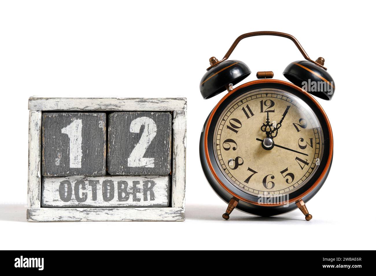 October 12 on wooden calendar with alarm clock white background Stock ...