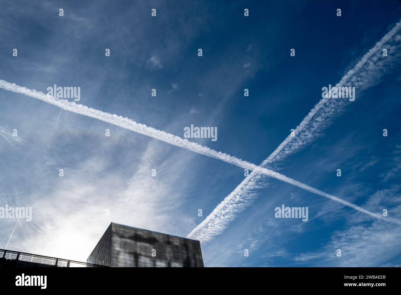 Contrails make an x hi-res stock photography and images - Alamy
